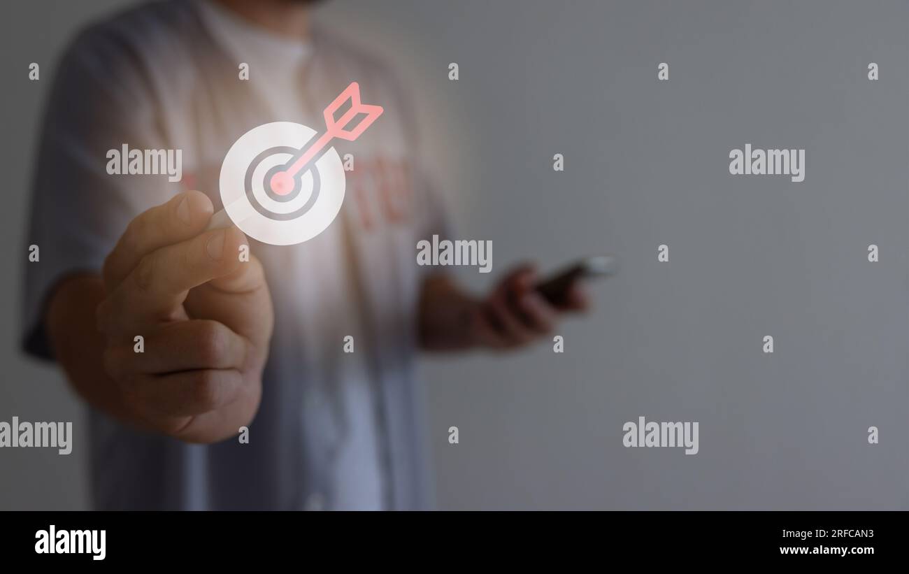 Man touching a target marketing concept on a touch screen with his ...
