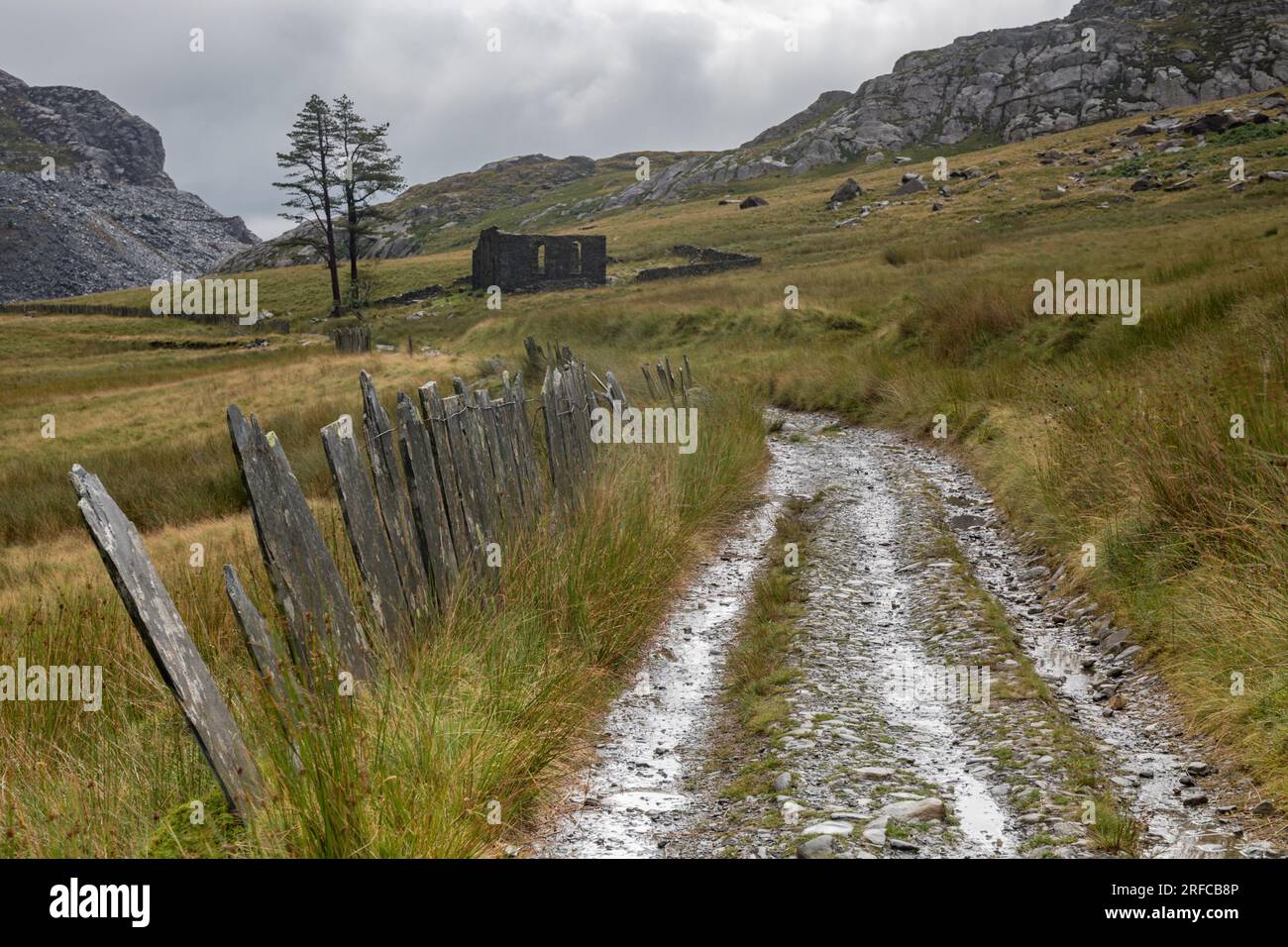 Cwmorthin Slate Quarry pathway with a fence made of old slate leading ...