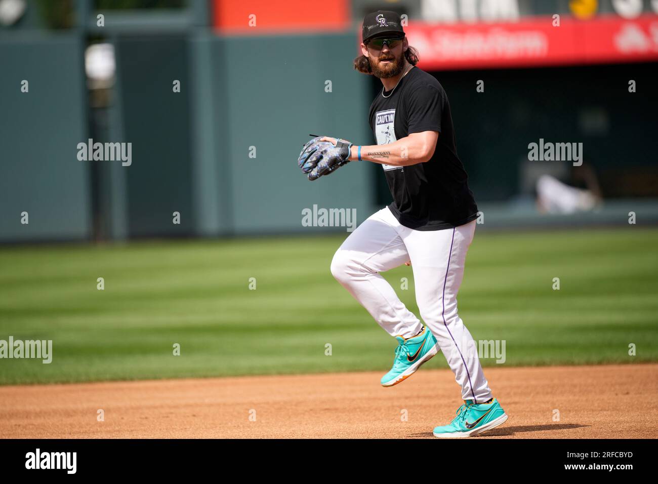 Colorado Rockies second baseman Brendan Rodgers warms up before a ...