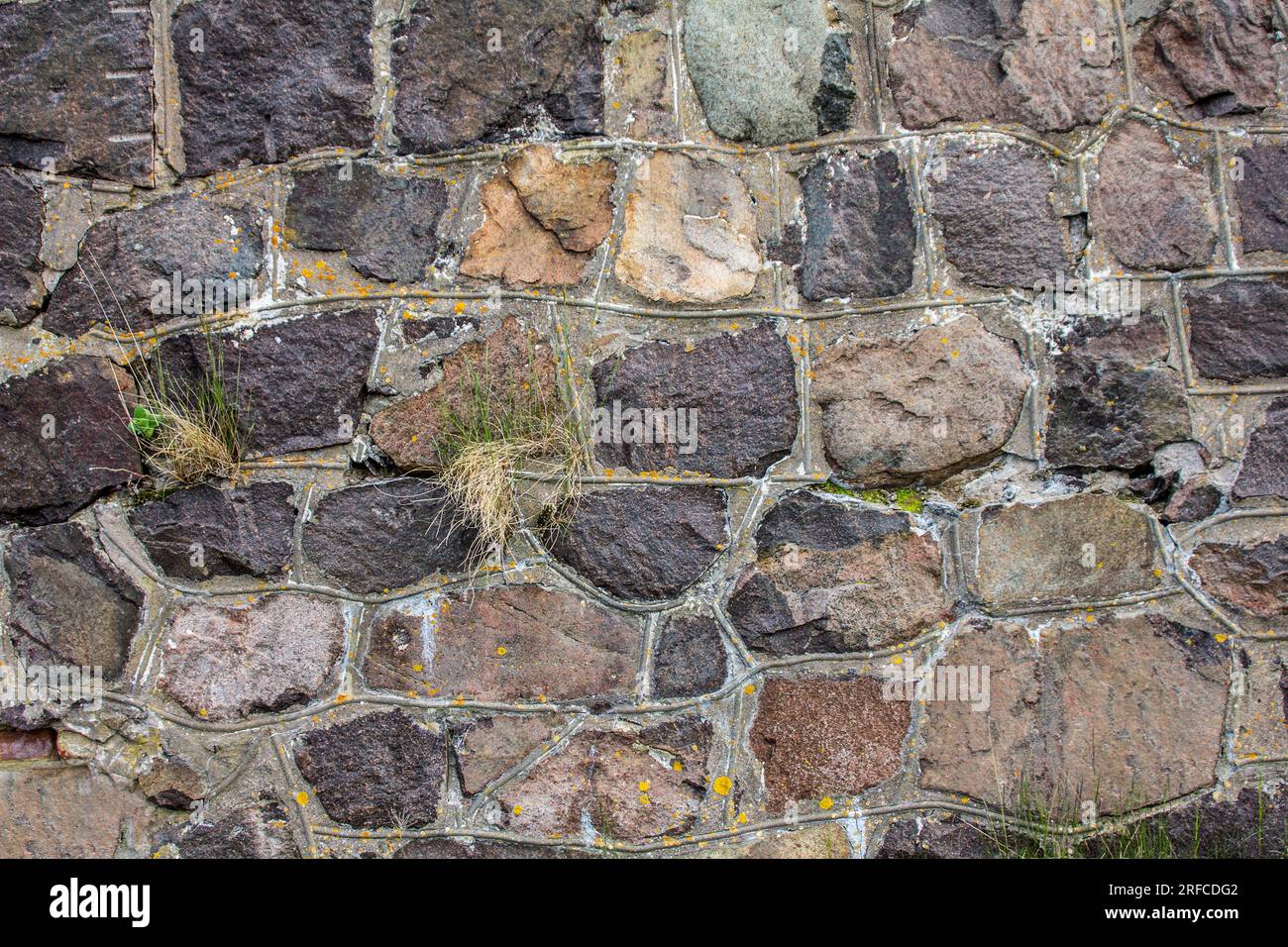Wall was carefully built of crude stone in 19th century. Mortar masonry ...
