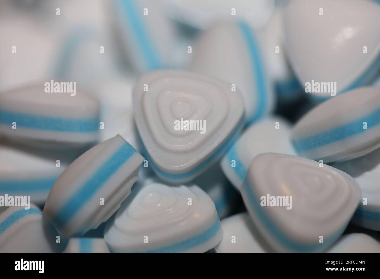 Group of sweet colorful candy light blue triangle refreshment caramel ...