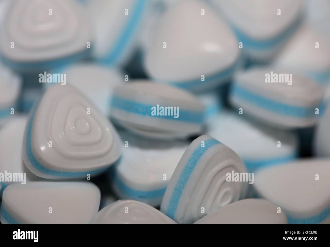 Group of sweet colorful candy light blue triangle refreshment caramel ...