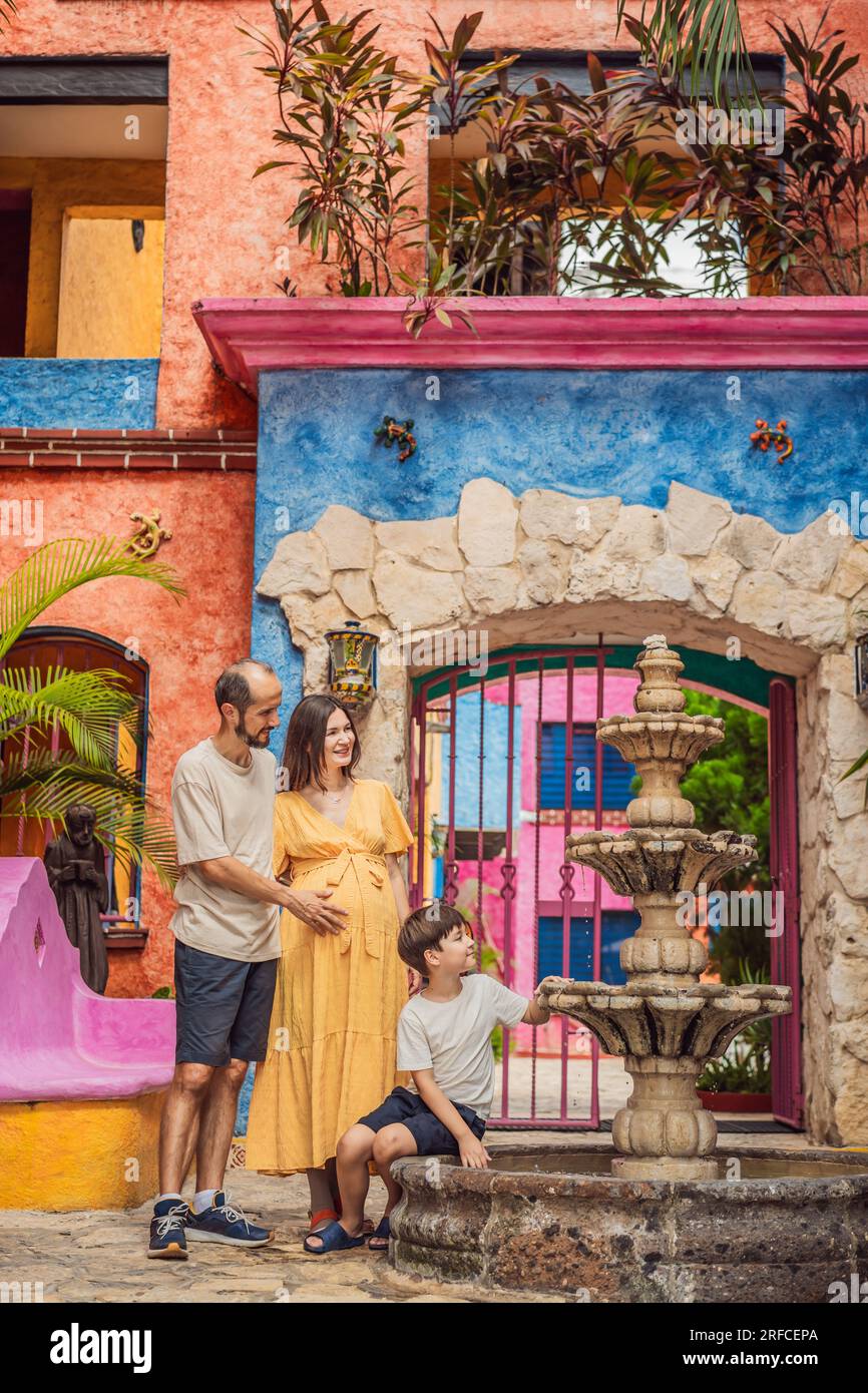 A loving couple in their 40s and their teenage son cherishing the ...