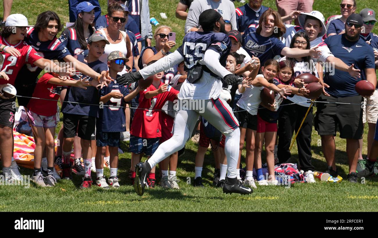 New England Patriots linebacker Josh Uche (55) high fives fans ...