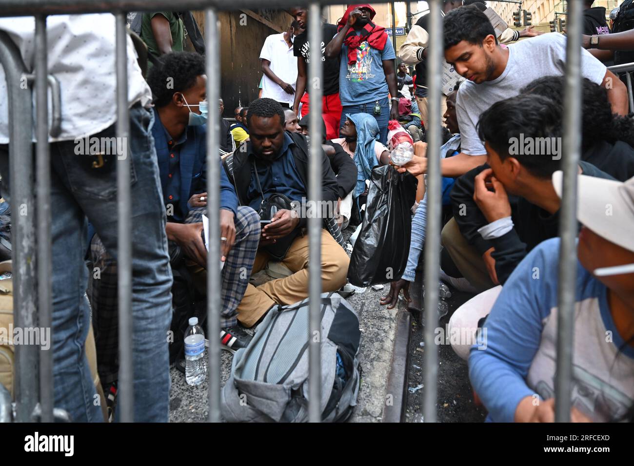 Asylum seekers camp outside the Roosevelt Hotel on the sidewalks along ...