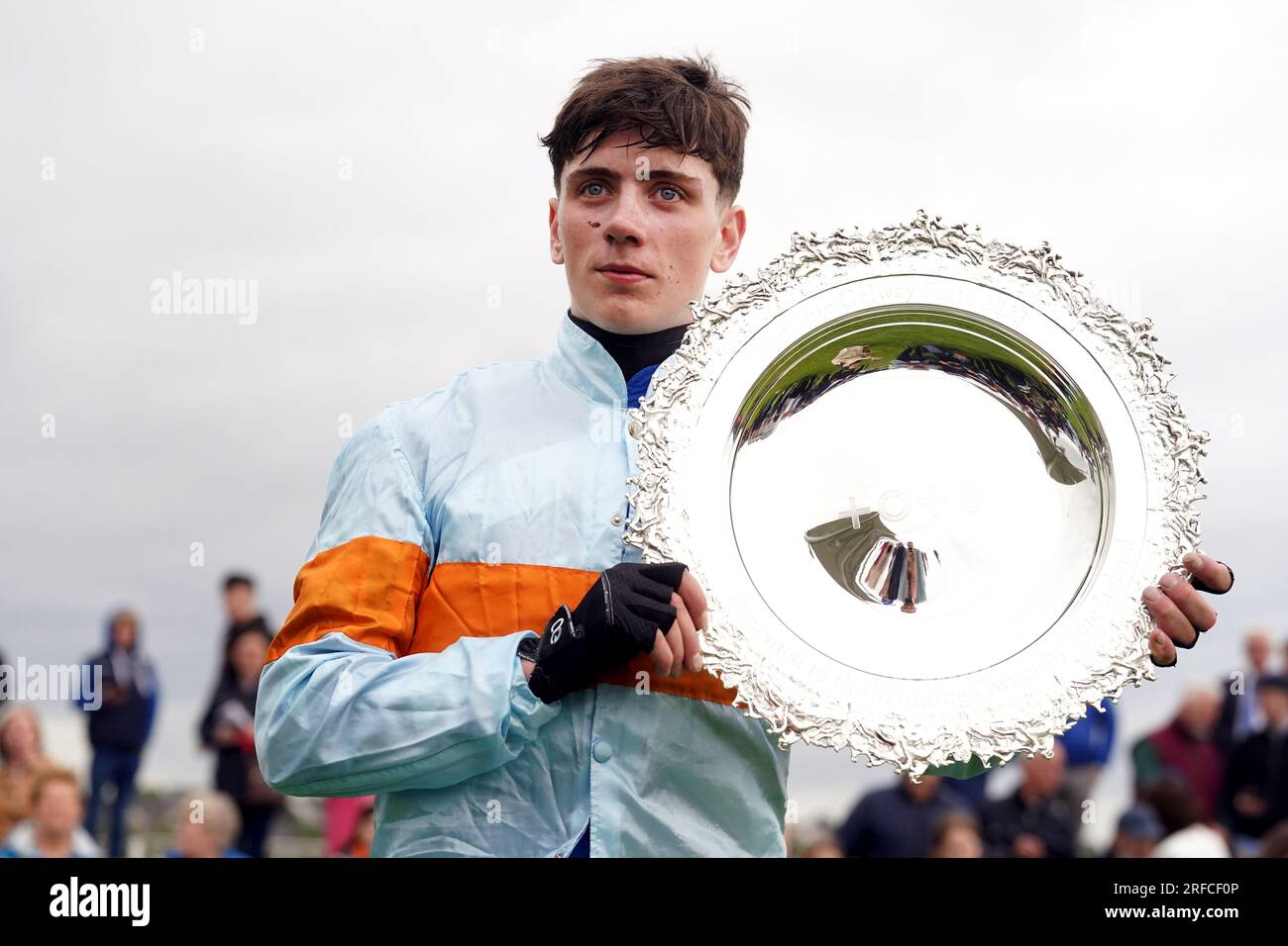 Jockey Danny Gilligan with the plate after winning the Tote Galway ...