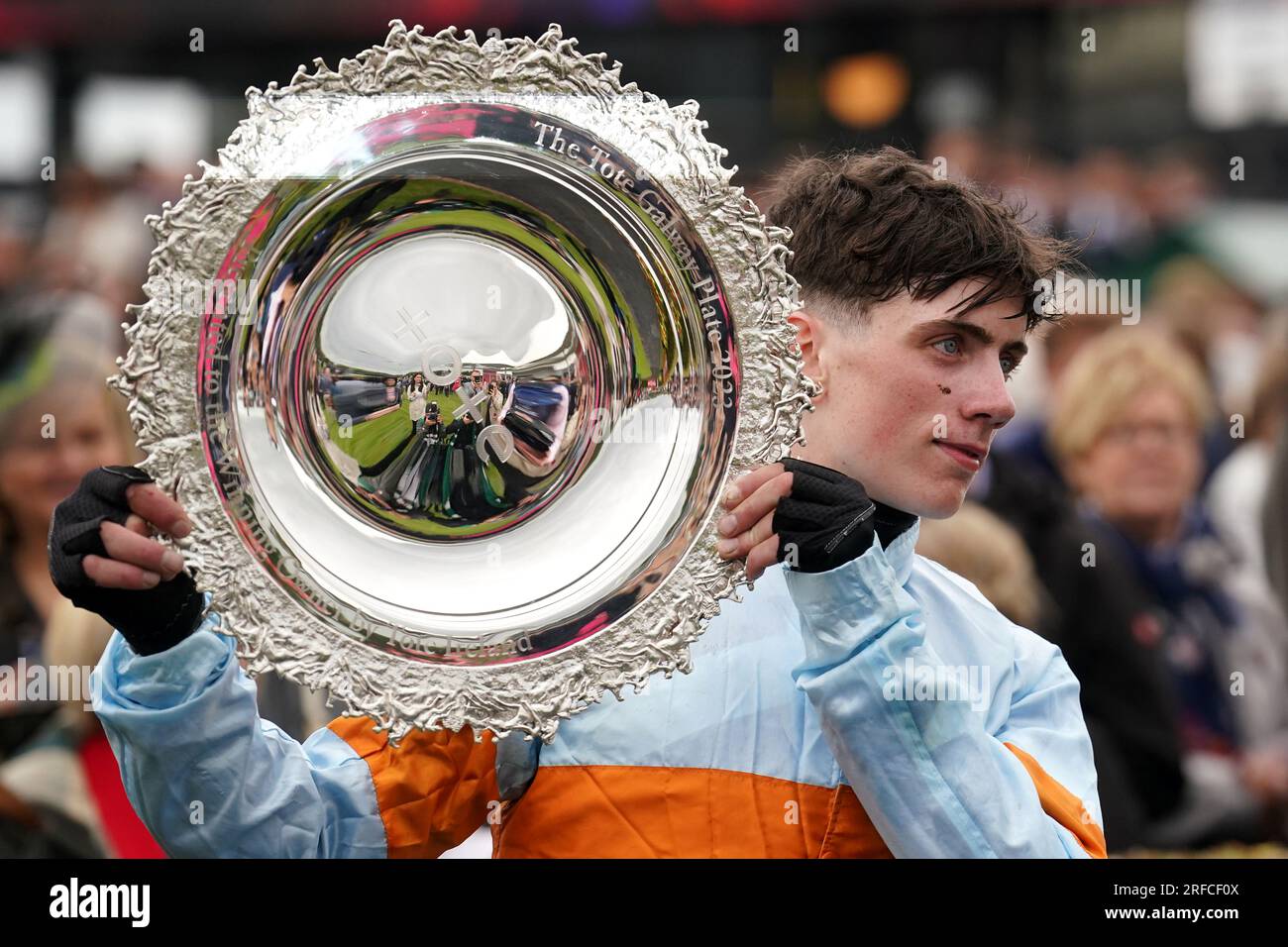 Jockey Danny Gilligan with the plate after winning the Tote Galway ...