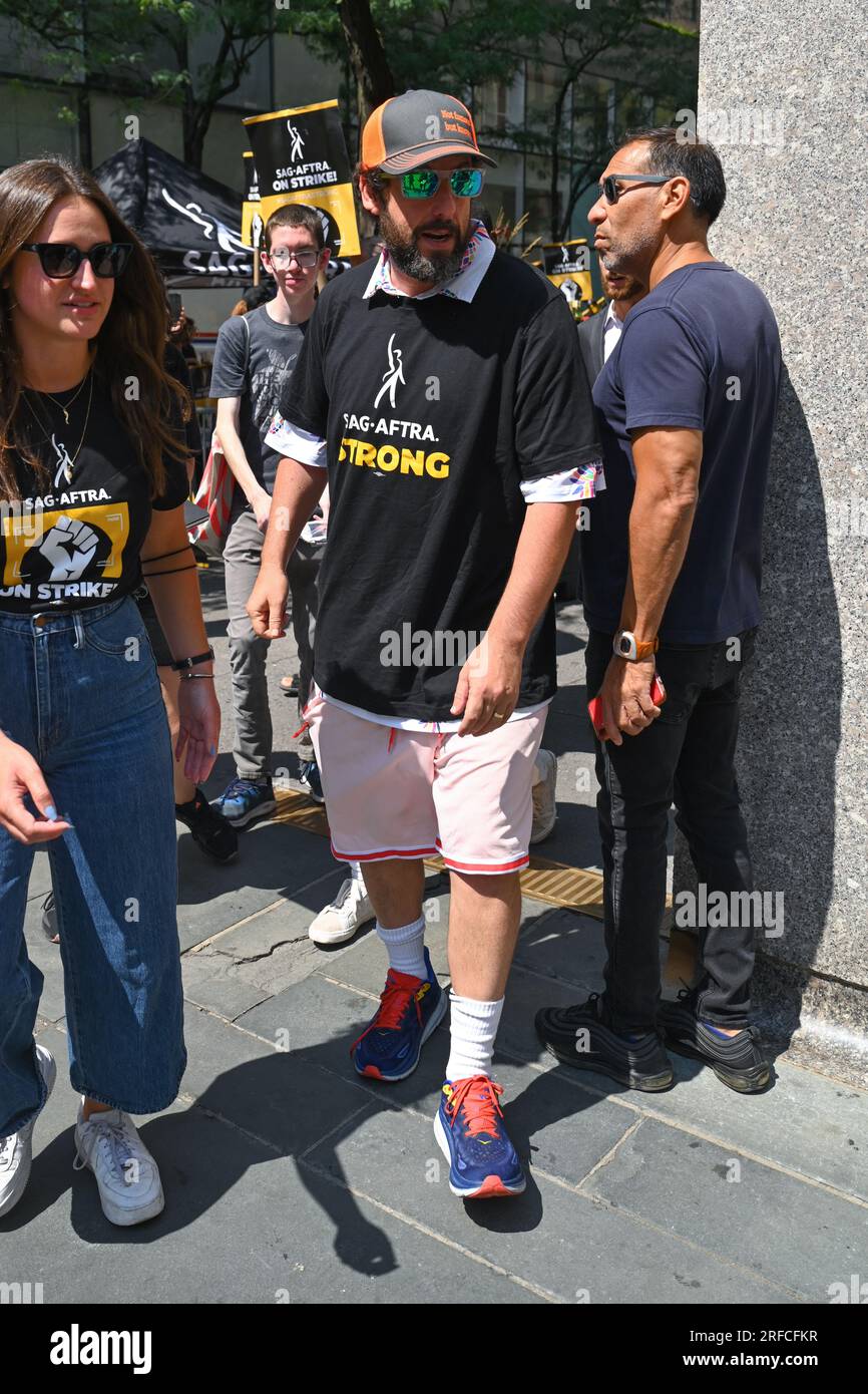 Adam Sandler walks a picket line outside NBC Studios at 30 Rockefeller ...