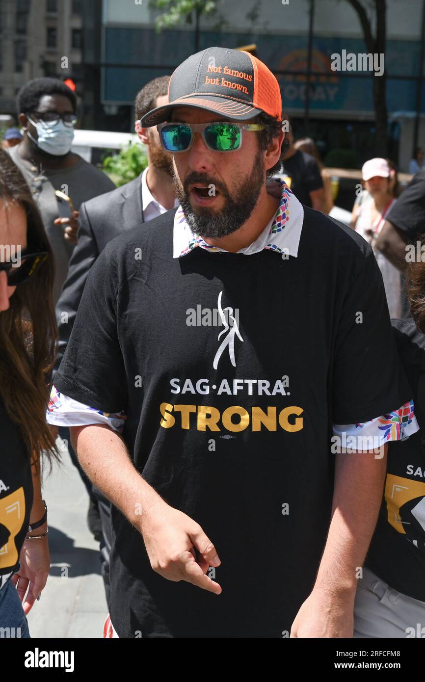 Adam Sandler walks a picket line outside NBC Studios at 30 Rockefeller ...