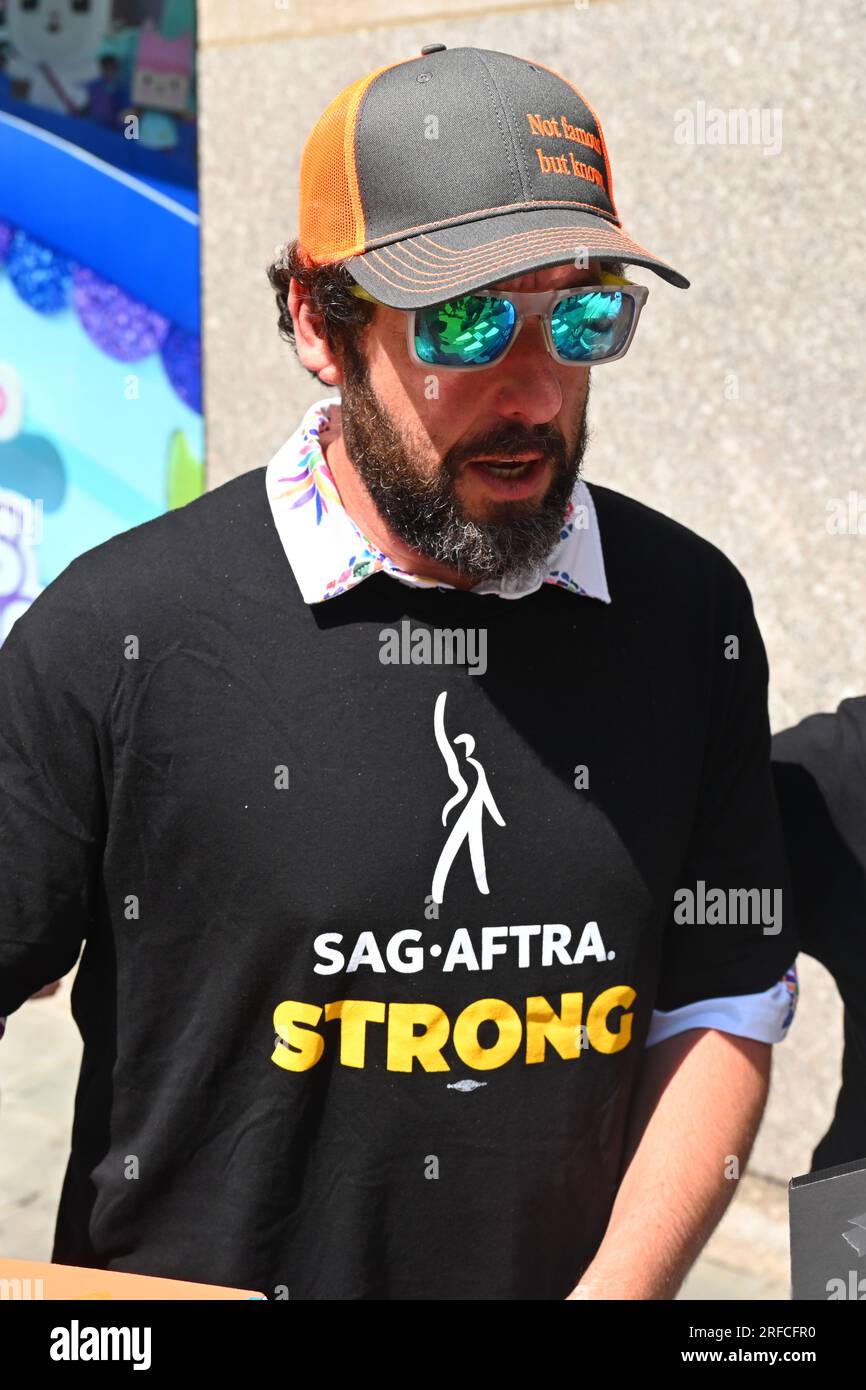 Adam Sandler walks a picket line outside NBC Studios at 30 Rockefeller ...