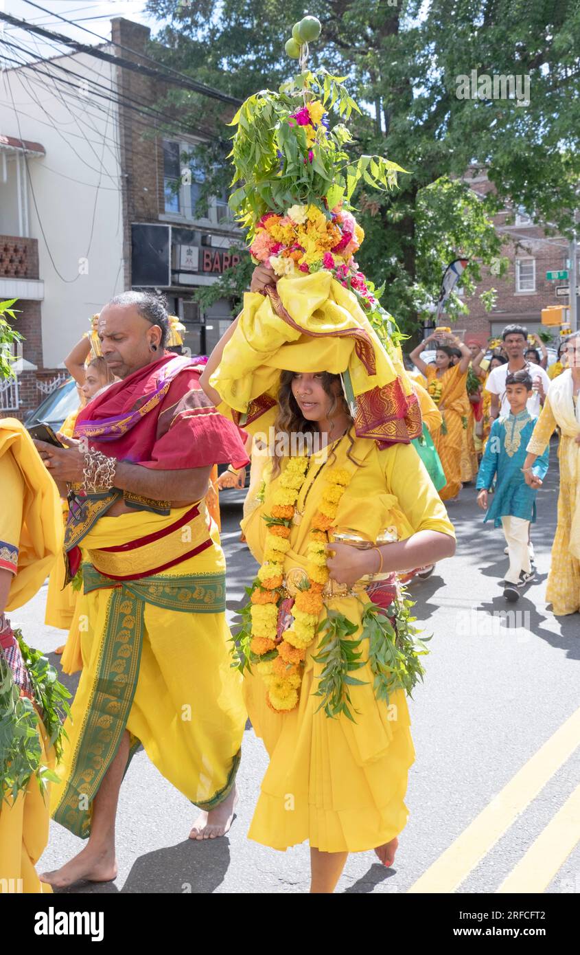 A pandita preistess marches from her temple to the site of the Thimithi ...