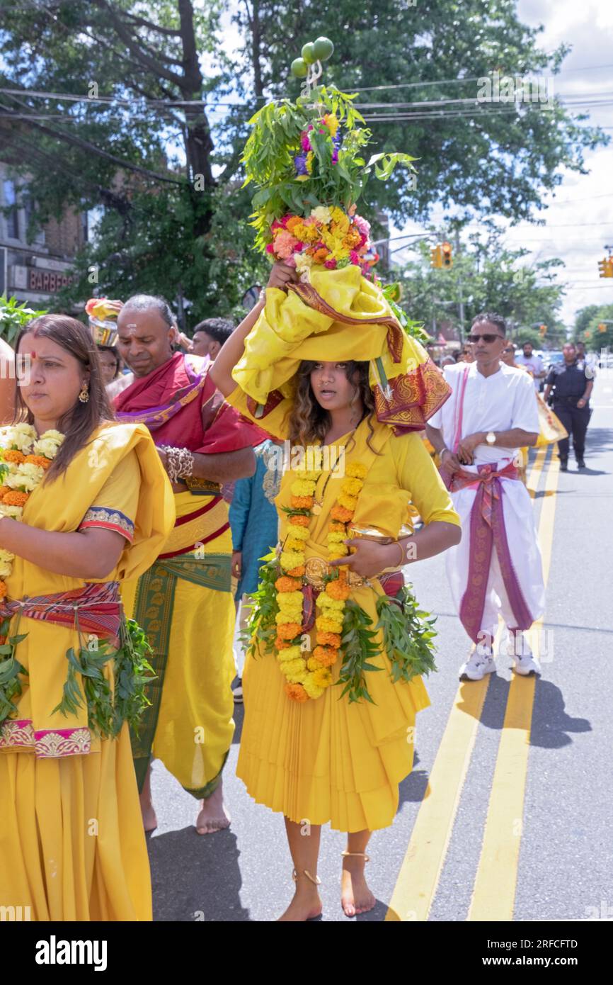 A pandita preistess marches from her temple to the site of the Thimithi ...