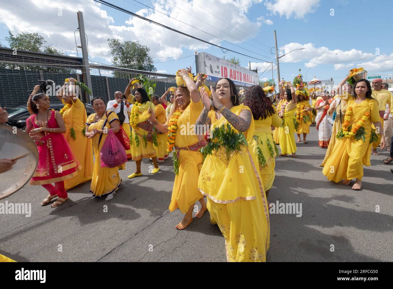 Cheer at the conclusion of a long Hindu parade from their temple in ...