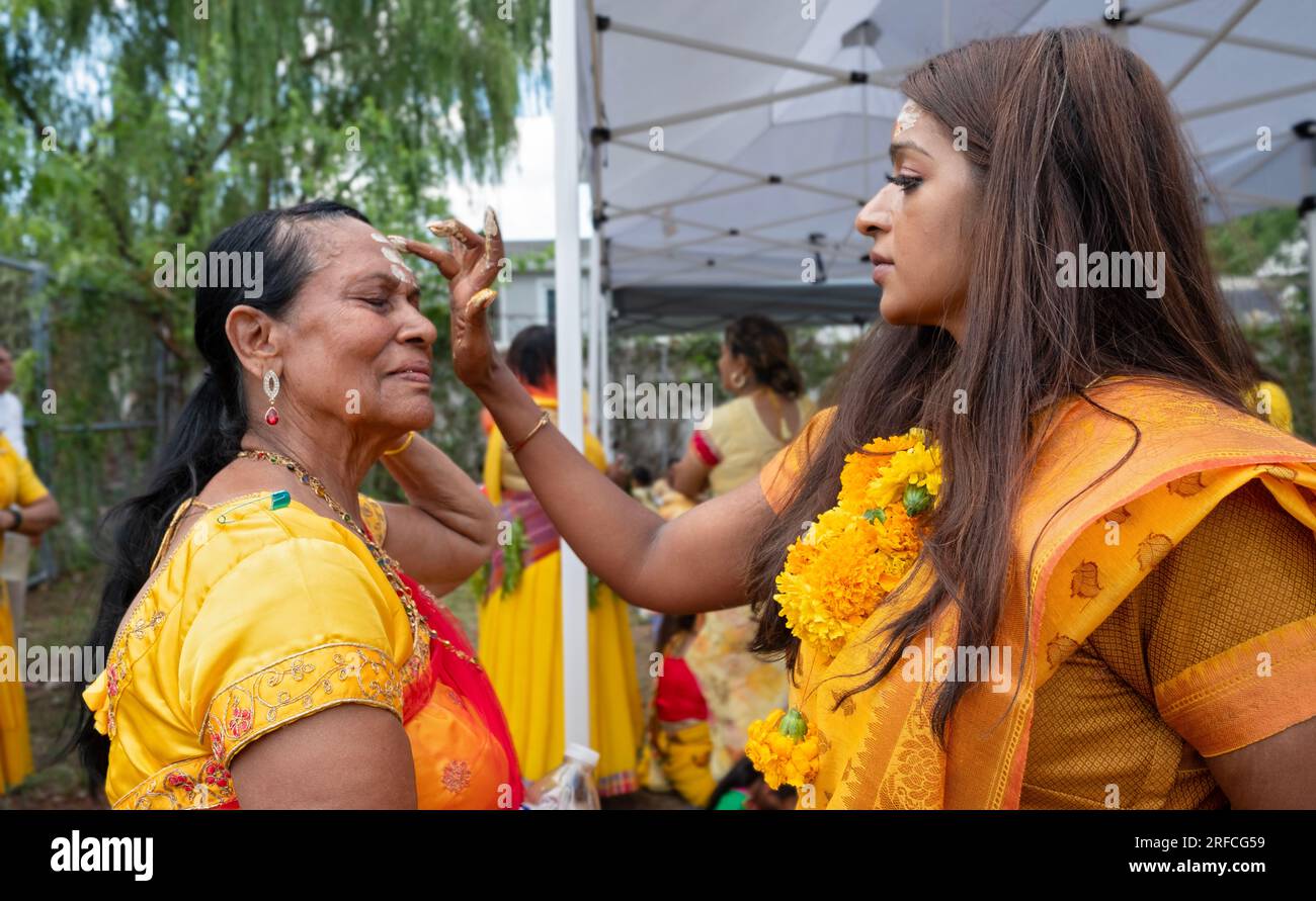 Prior to the fire walking ceremony at the Arya Spiritual Ground a young ...