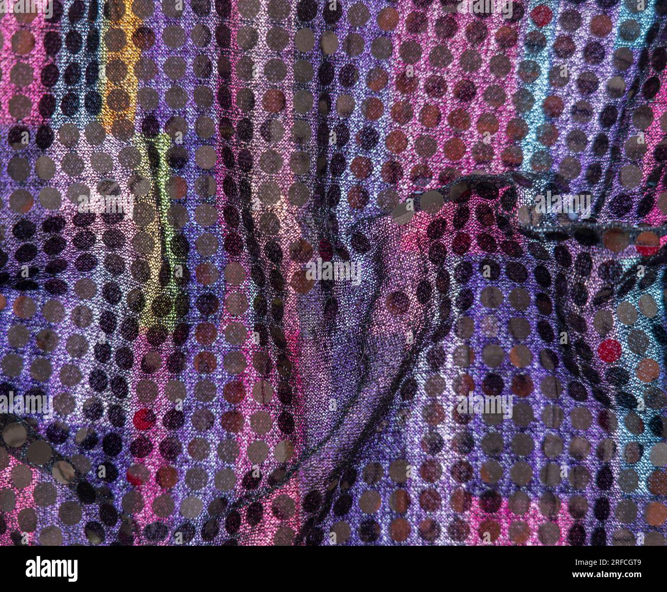 Layers of material are backlit & show a screen gridwork. Colors are ...