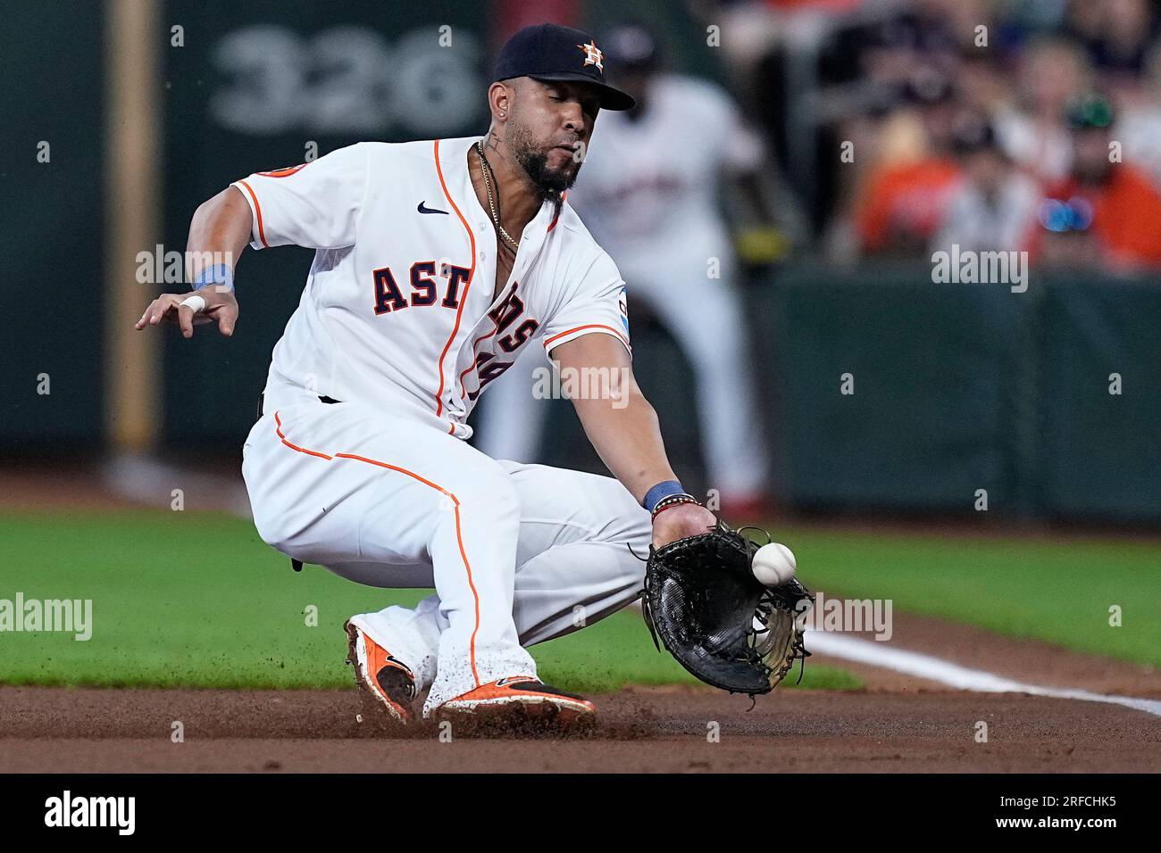 Houston Astros first baseman Jose Abreu can't handle a base hit by ...