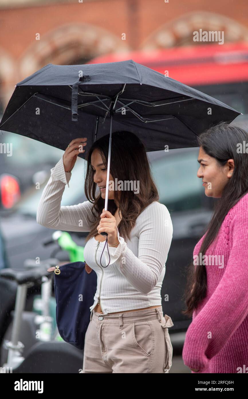 Umbrella around head hi-res stock photography and images - Alamy
