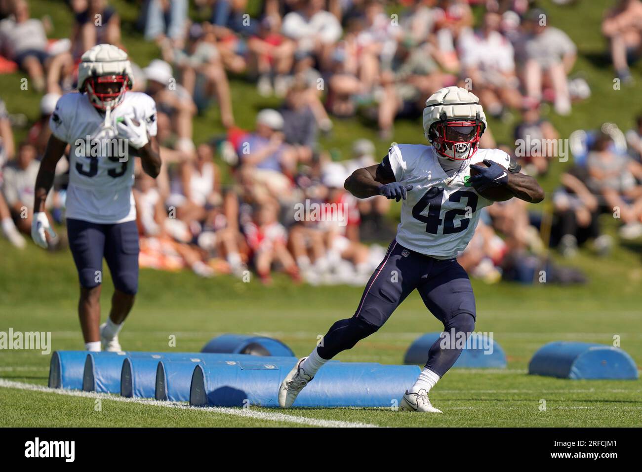 New England Patriots running back J.J. Taylor (42) performs field ...