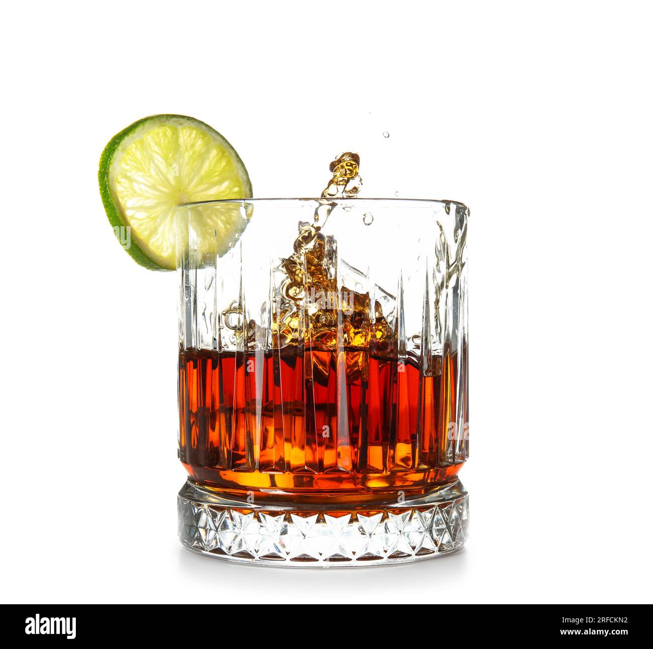 Glass of cold rum with splashes on white background Stock Photo - Alamy