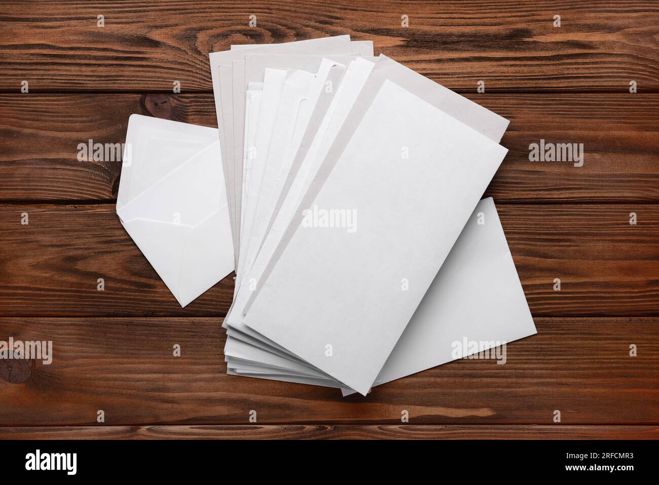 Stack of letters on wooden background Stock Photo - Alamy
