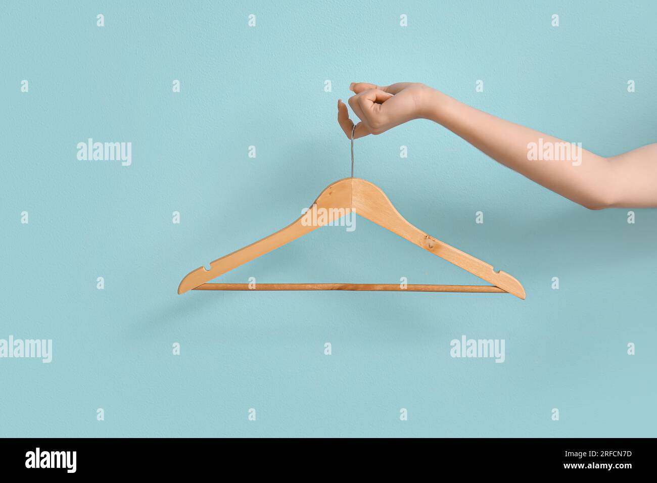 Hands holding clothes hanger hi-res stock photography and images - Alamy