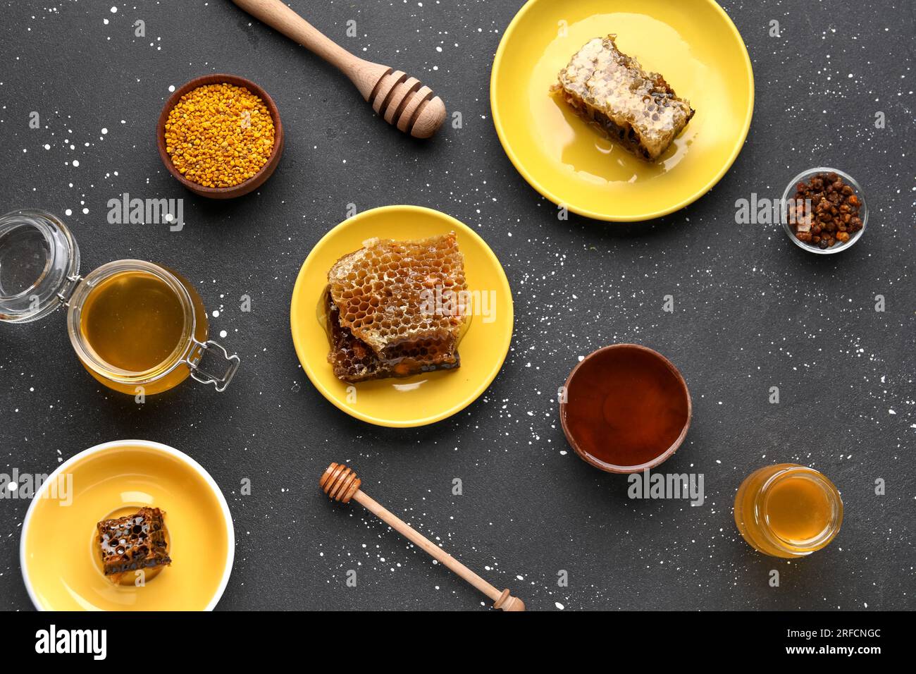 Sweet honey, combs and bee pollen on black background Stock Photo - Alamy