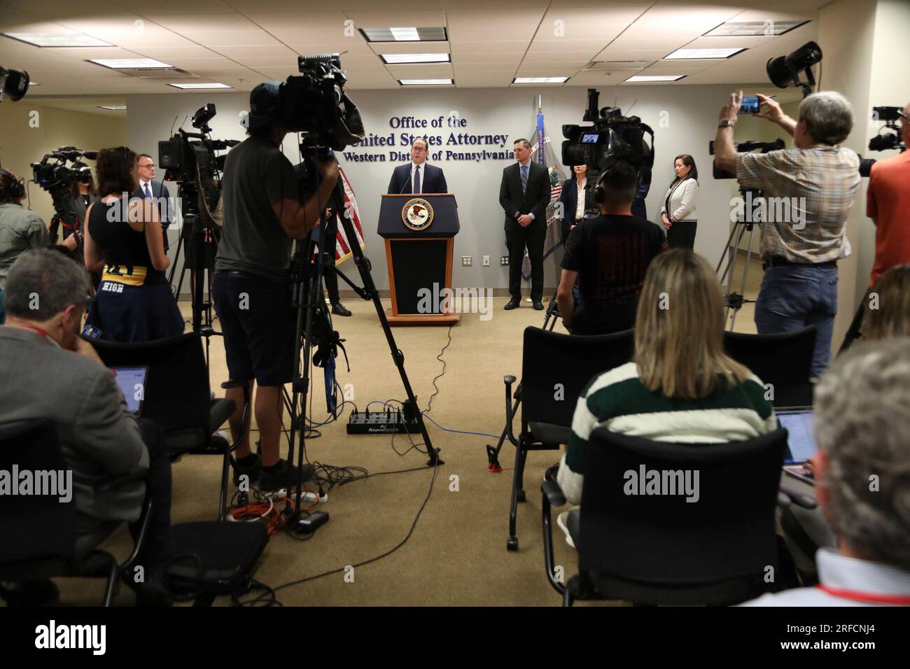 US Attorney Eric Olshan speaks the media following the sentencing of ...