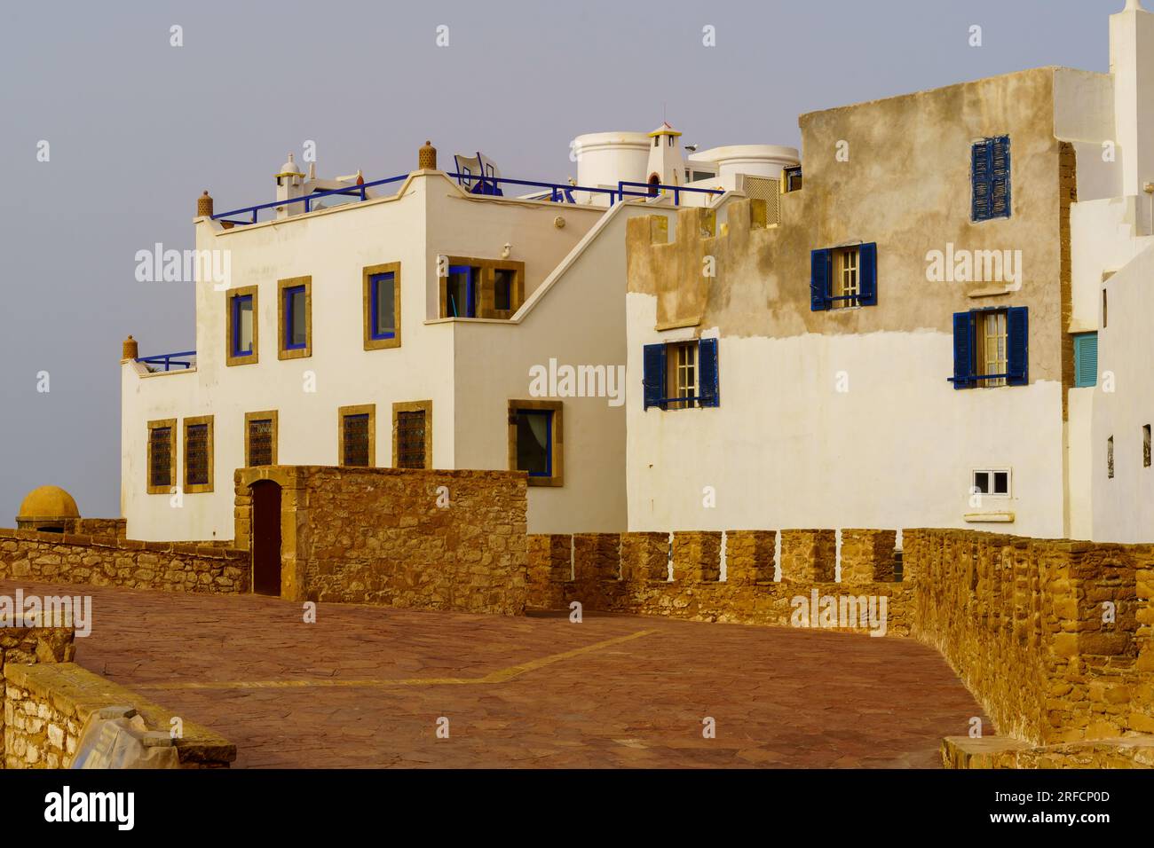 View of typical buildings, and the walls of the medina, in Essaouira ...