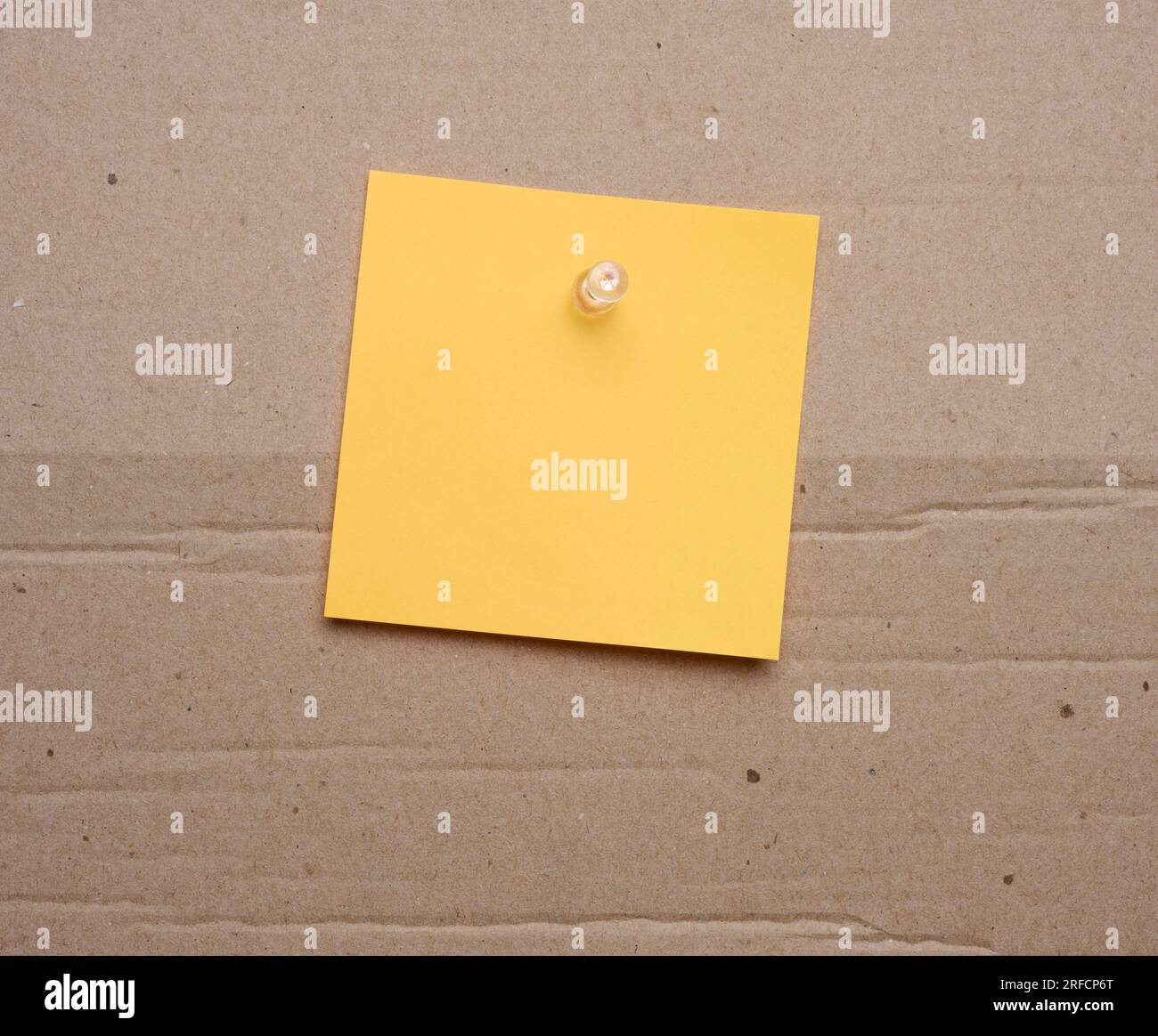 Yellow paper blank stickers attached with a button, space for notes and ...