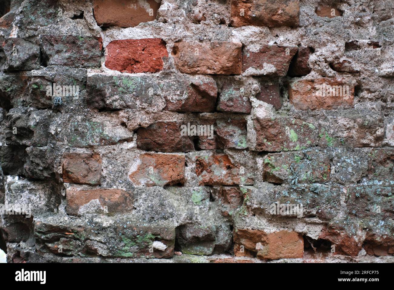 Grungy historical broken brick wall background in autumn day. Abstract ...