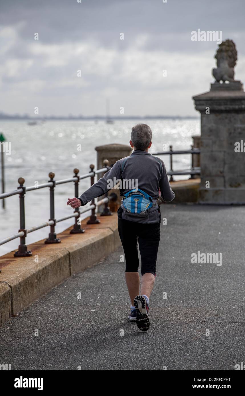 older woman power walking at the seaside Stock Photo - Alamy
