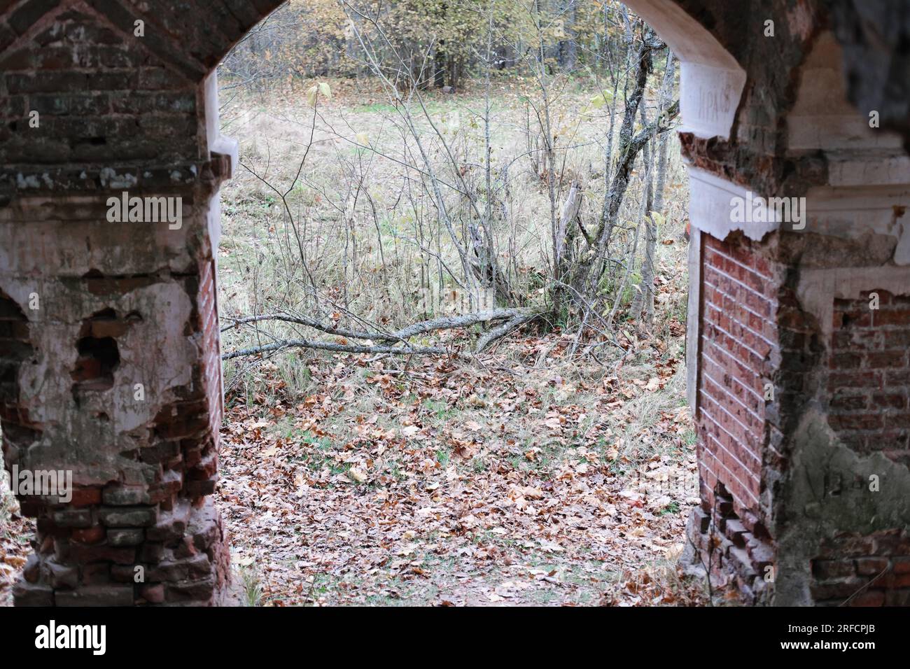 Arched window openings of a destroyed abandoned building. Broken ...