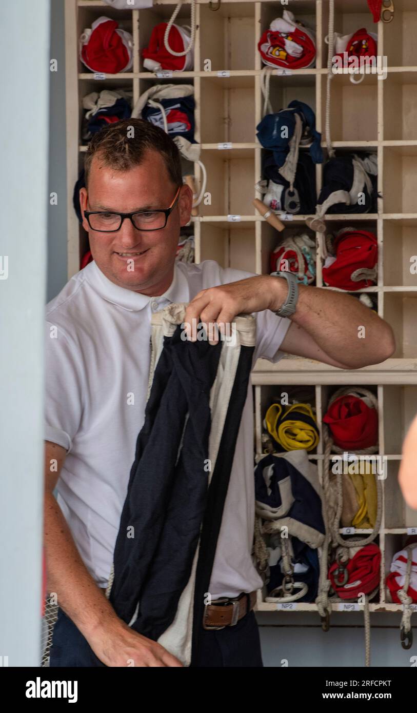royal yacht squadron signaller folding signal flags during the annual ...