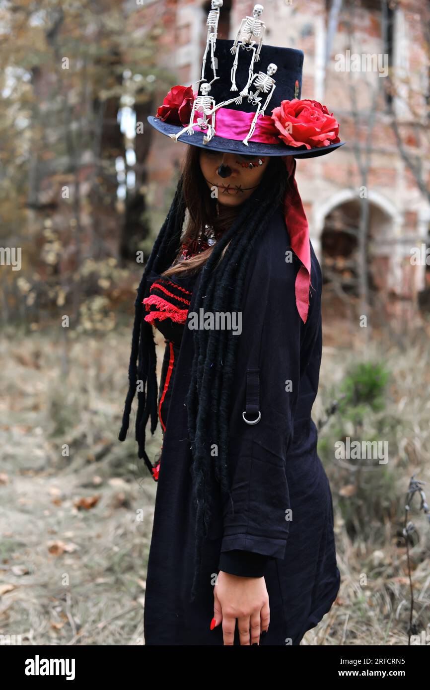 A woman in the image of Baron Saturday poses against the backdrop of an ...