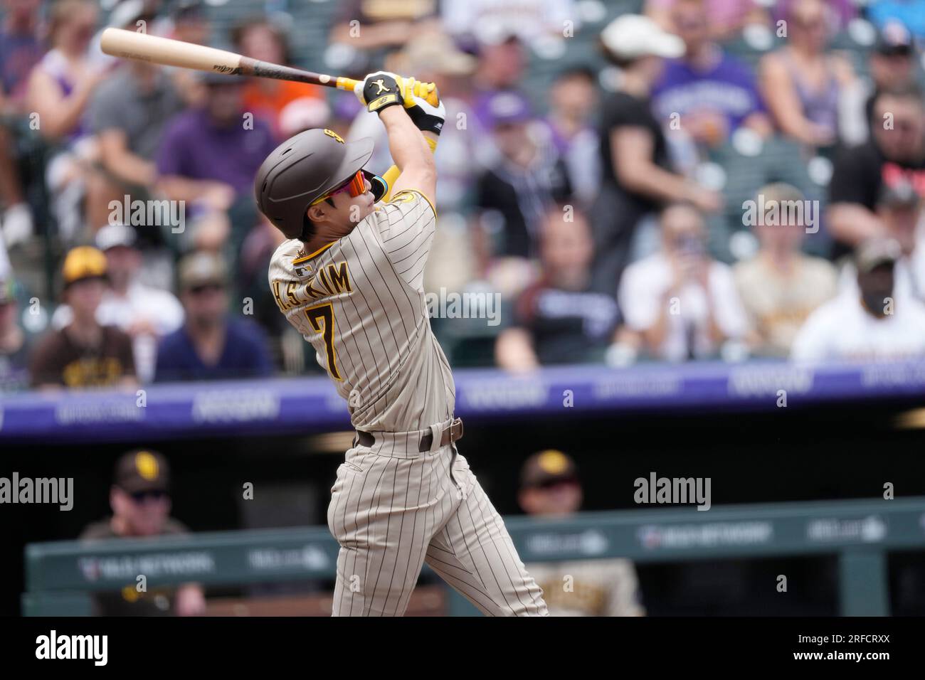 San Diego Padres' Ha-Seong Kim follows the flight of his solo home run ...