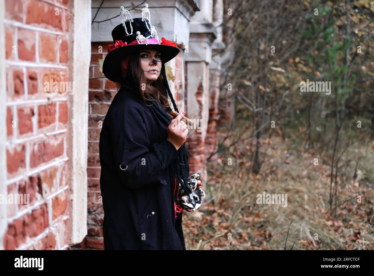 A woman in the form of Baron Saturday with a cigar in her hand. The ...