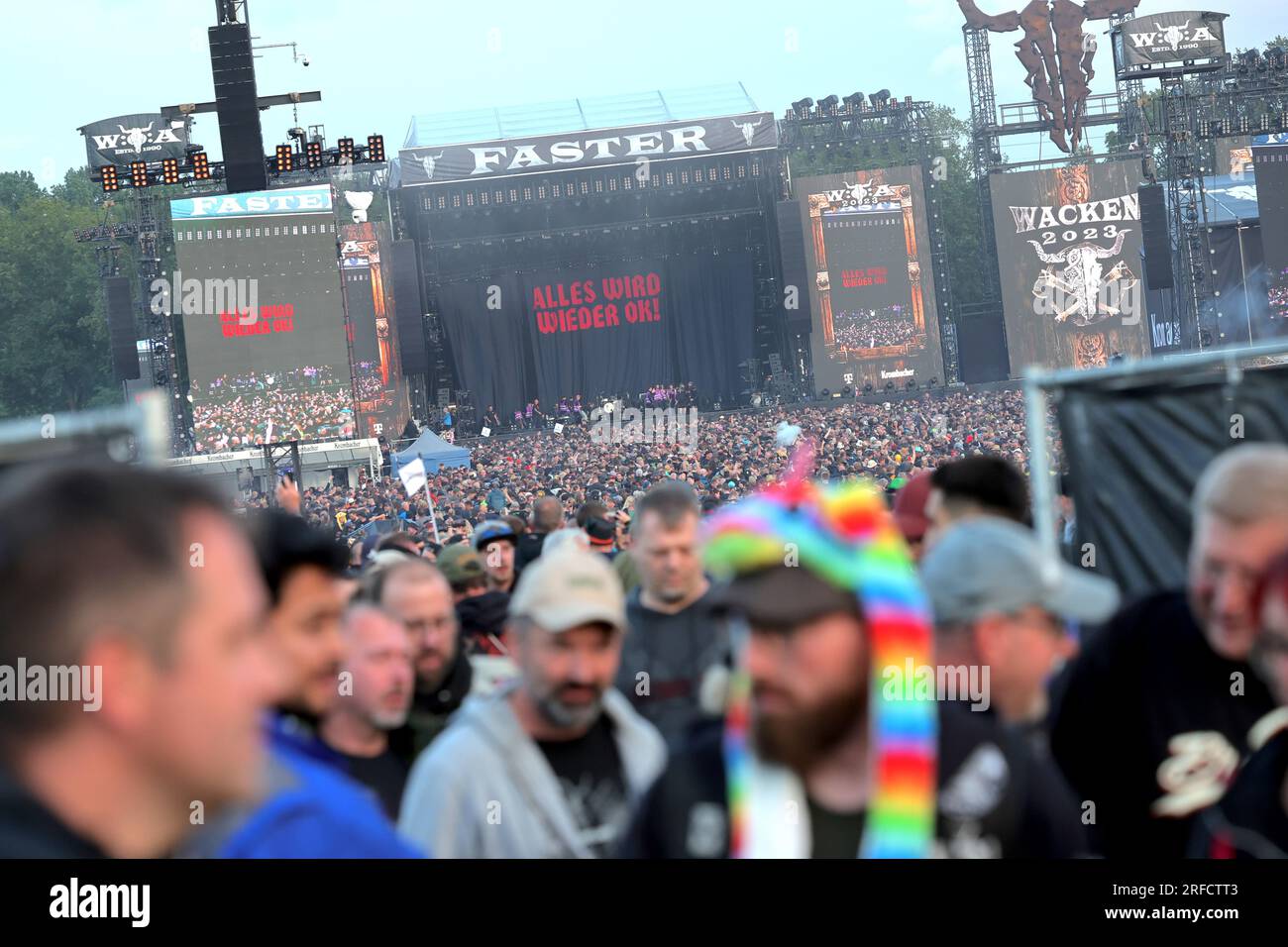 Wacken, Germany. 02nd Aug, 2023. Metal fans are on the festival grounds ...