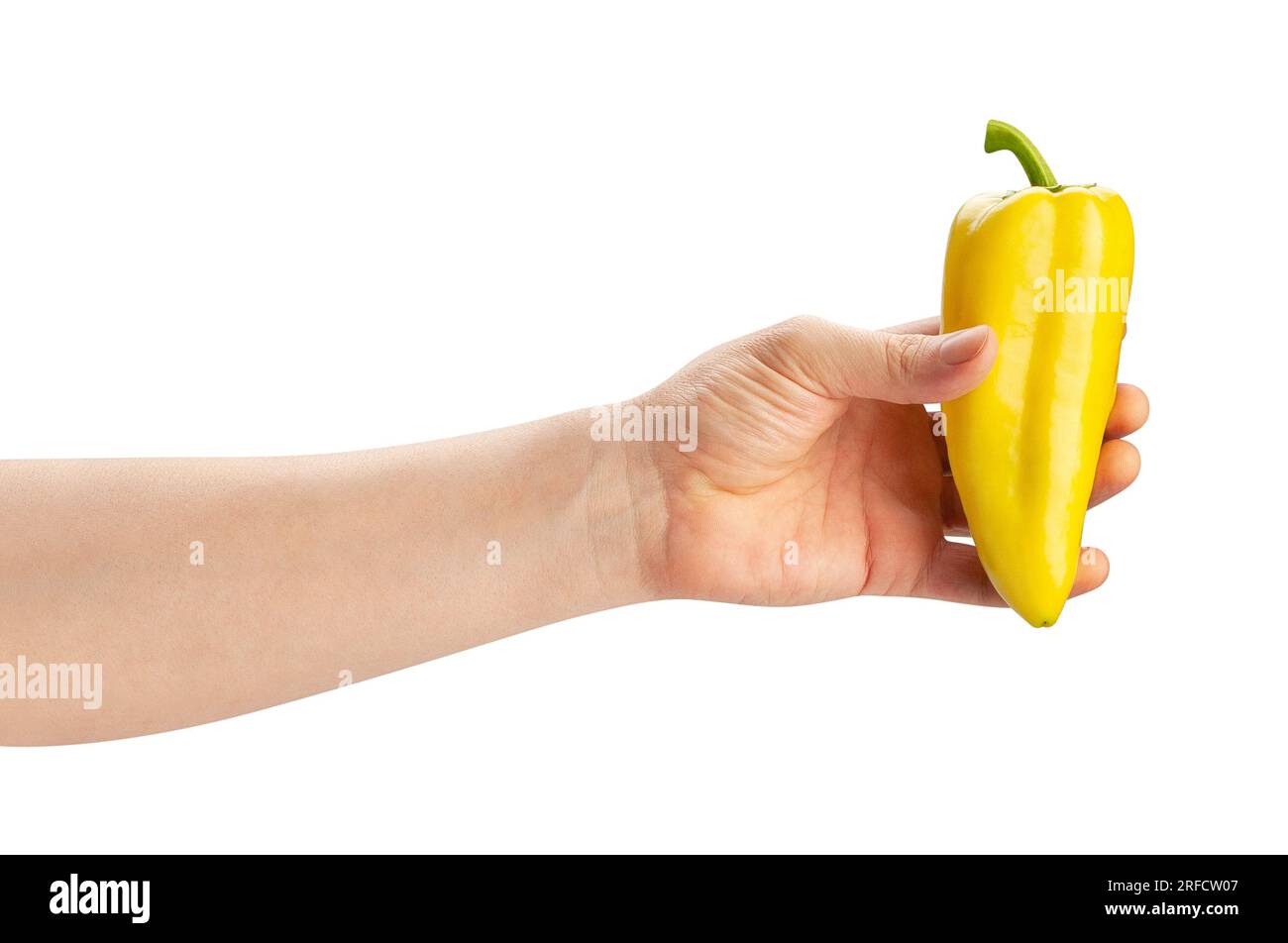 yellow pepper in hand path isolated on white Stock Photo - Alamy