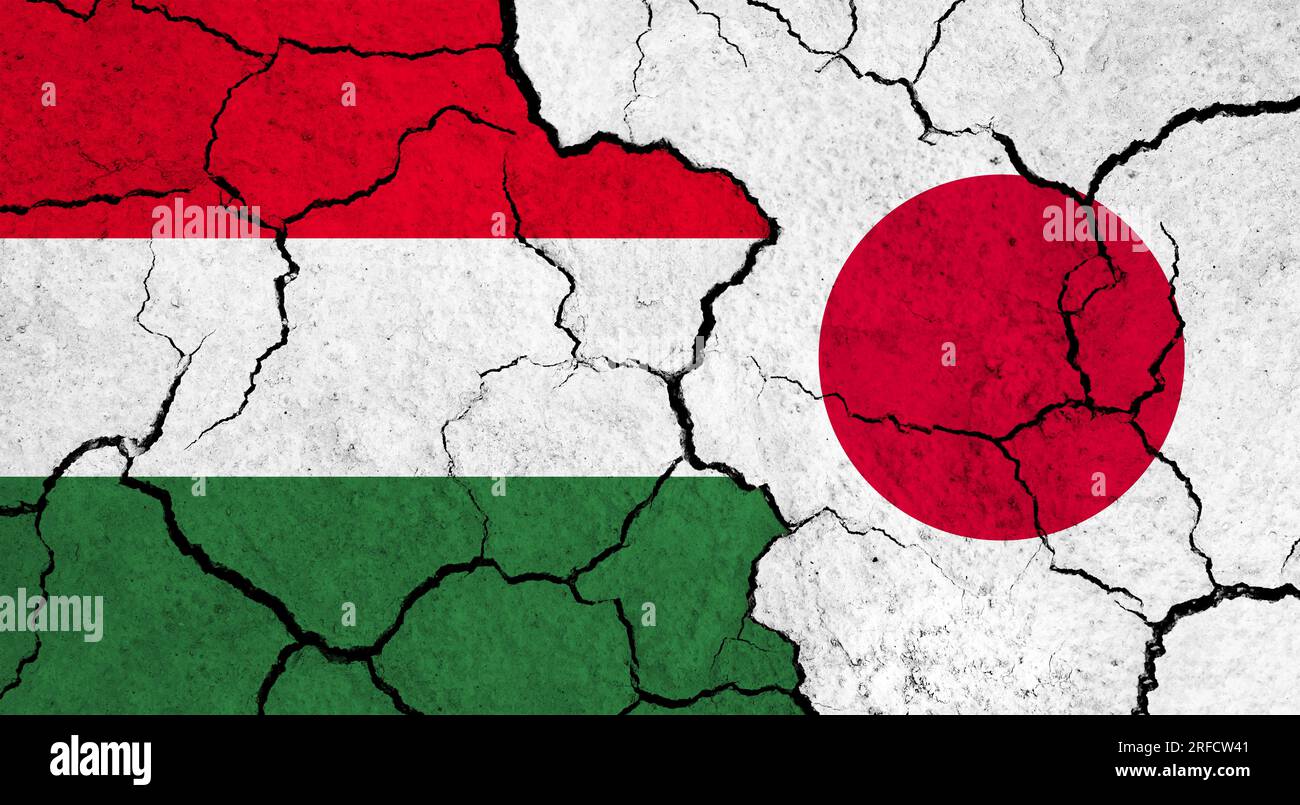 Flags of Hungary and Japan on cracked surface - politics, relationship ...