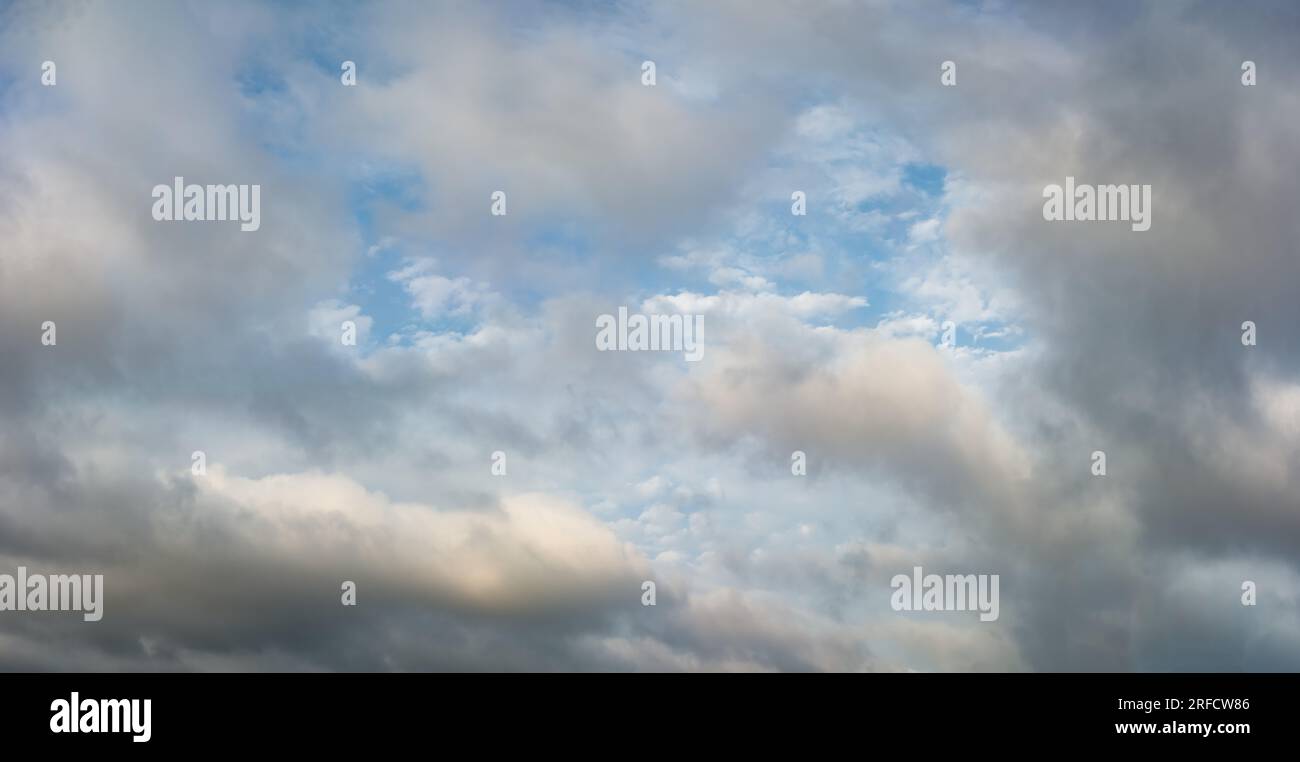 Layers of fast moving clouds on a humid summer evening Stock Photo - Alamy