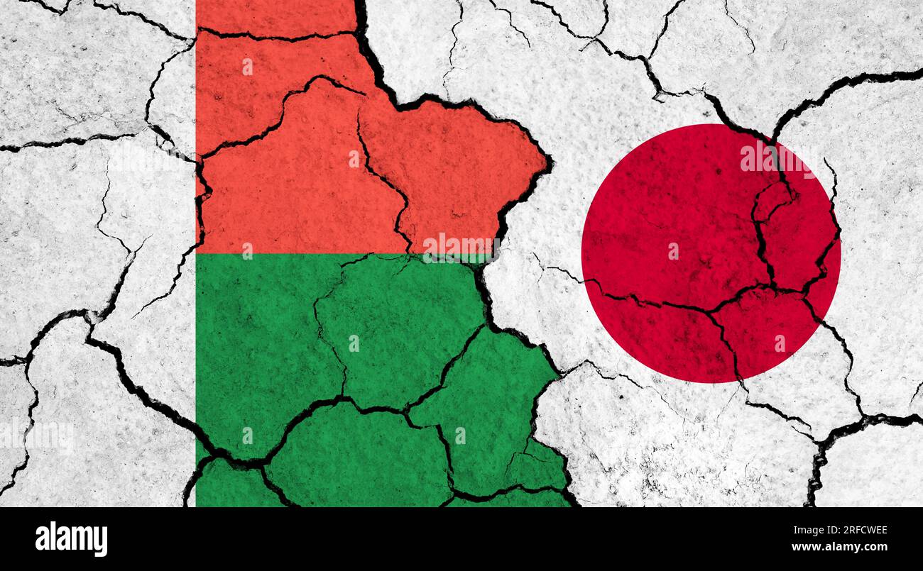 Flags of Madagascar and Japan on cracked surface - politics ...