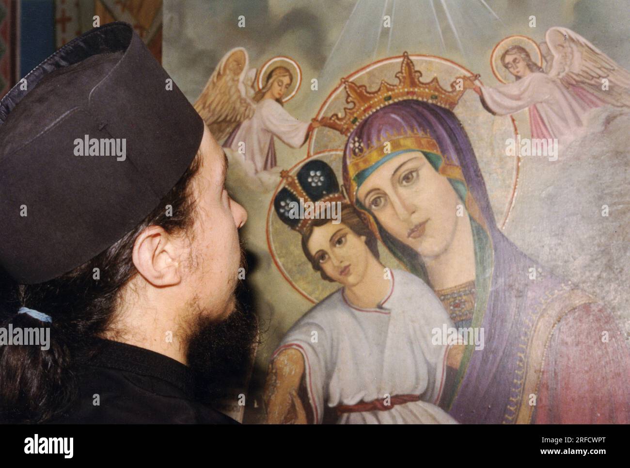Hadambu Monastery, Iasi County, Romania, 1999. Monk before the Orthodox ...