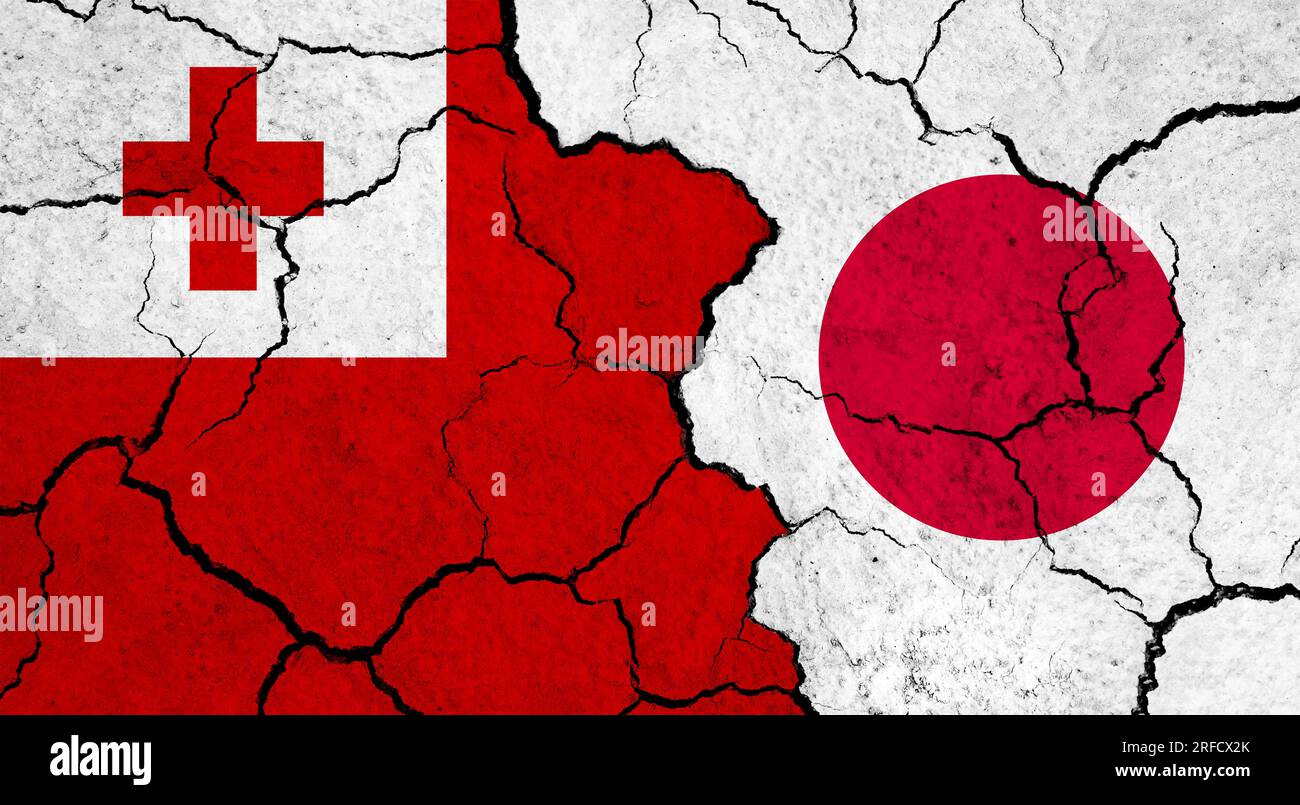Flags of Tonga and Japan on cracked surface - politics, relationship ...