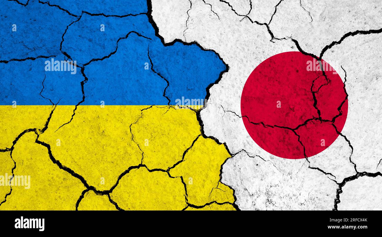 Flags of Ukraine and Japan on cracked surface - politics, relationship ...