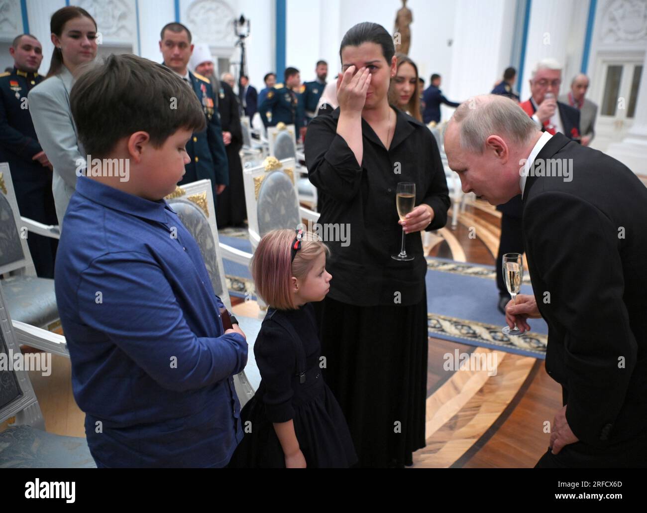 Russian President Vladimir Putin, right, speaks to daughter of Angelina ...