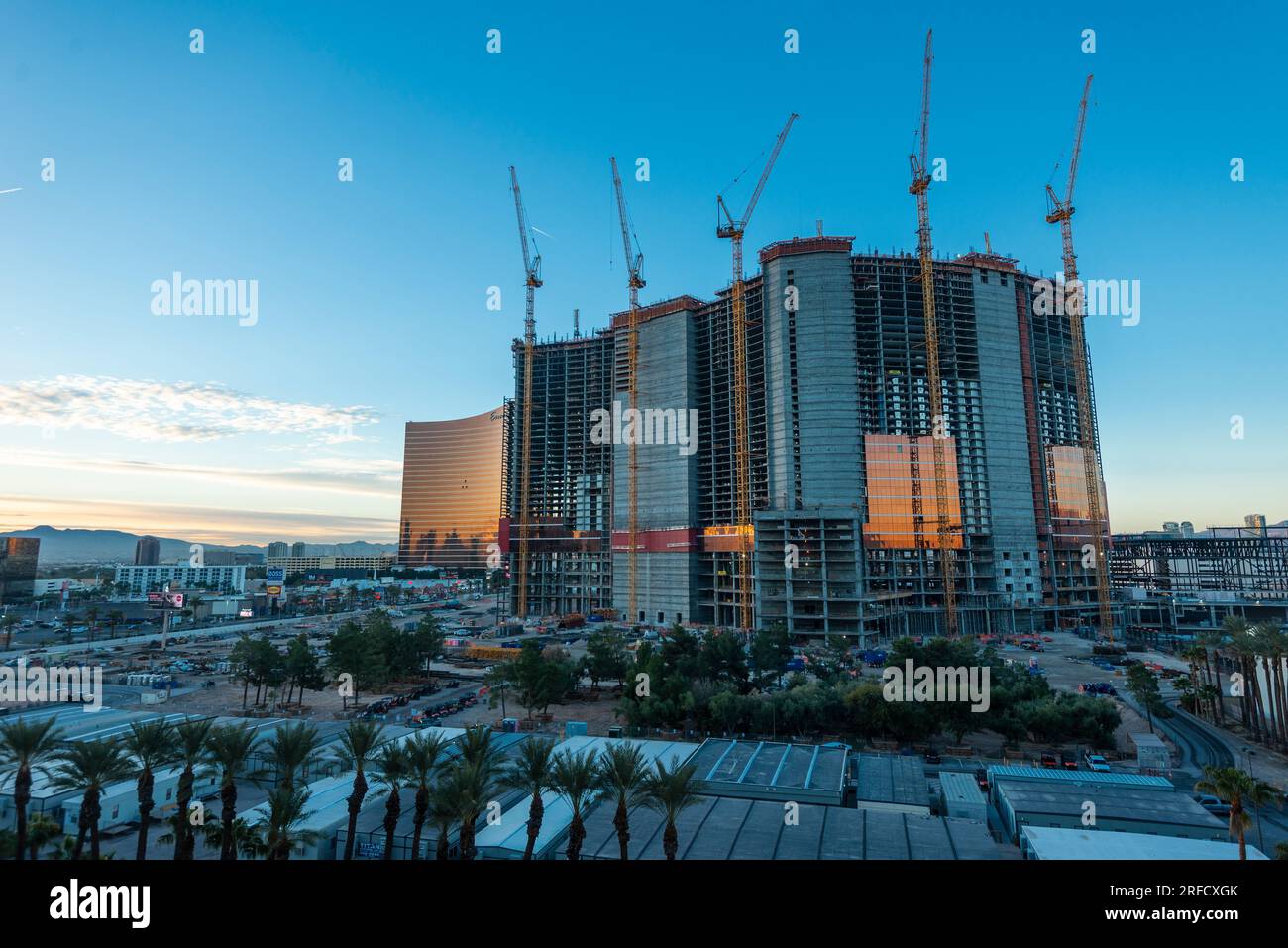 A new large hotel complex under construction with 5 cranes working in ...