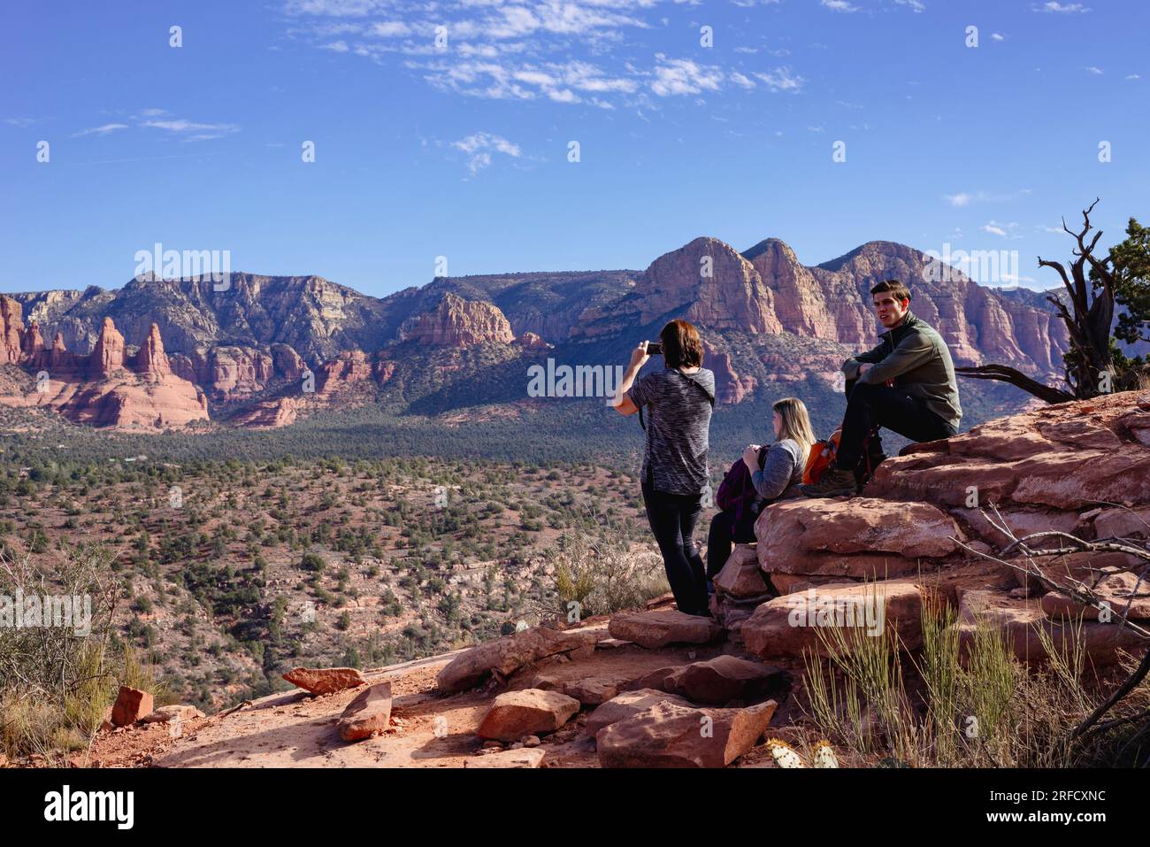 A family take a rest and enjoy the incredible views over the valley ...