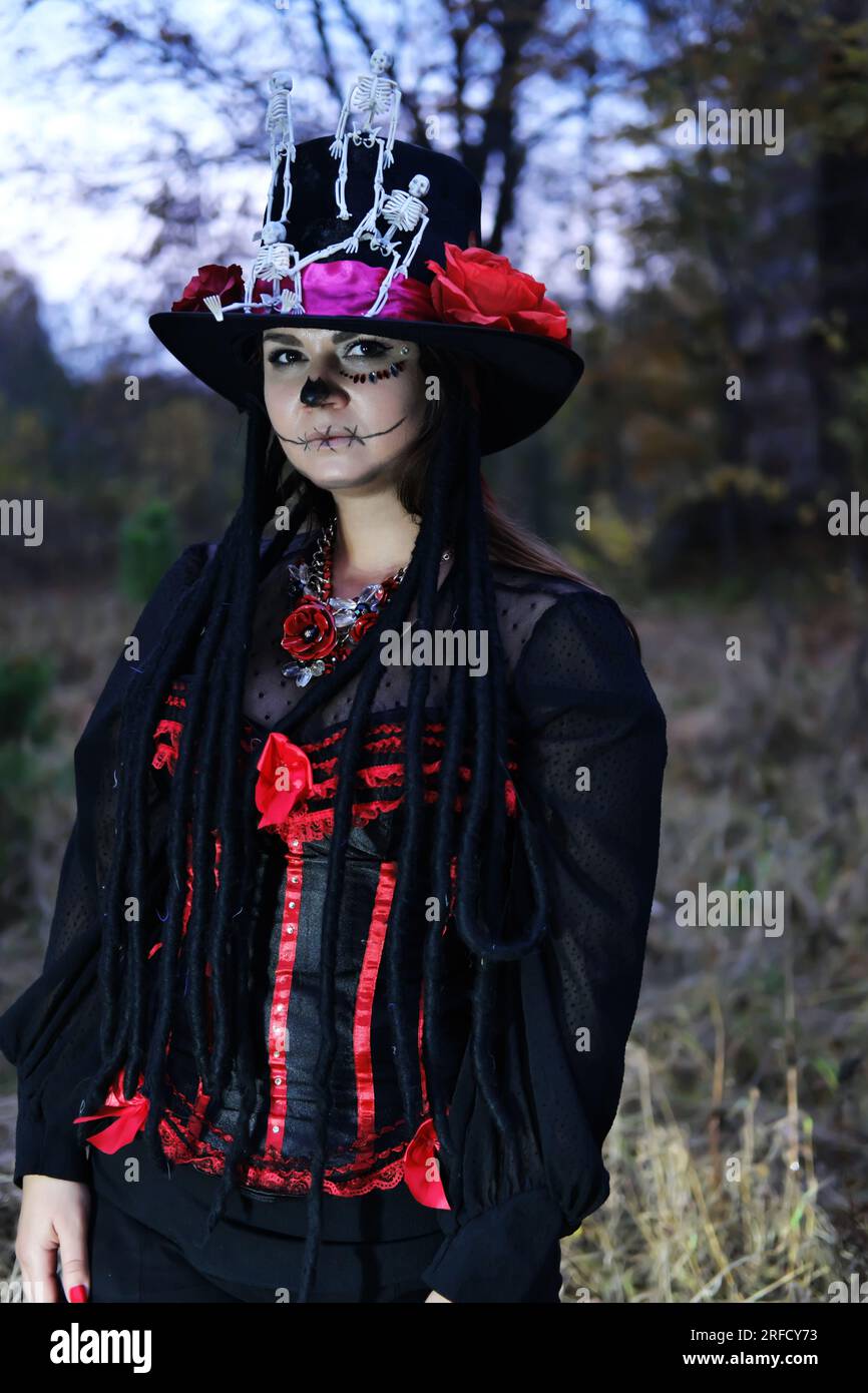 A woman dressed as Baron Saturday poses for the camera. The model is ...