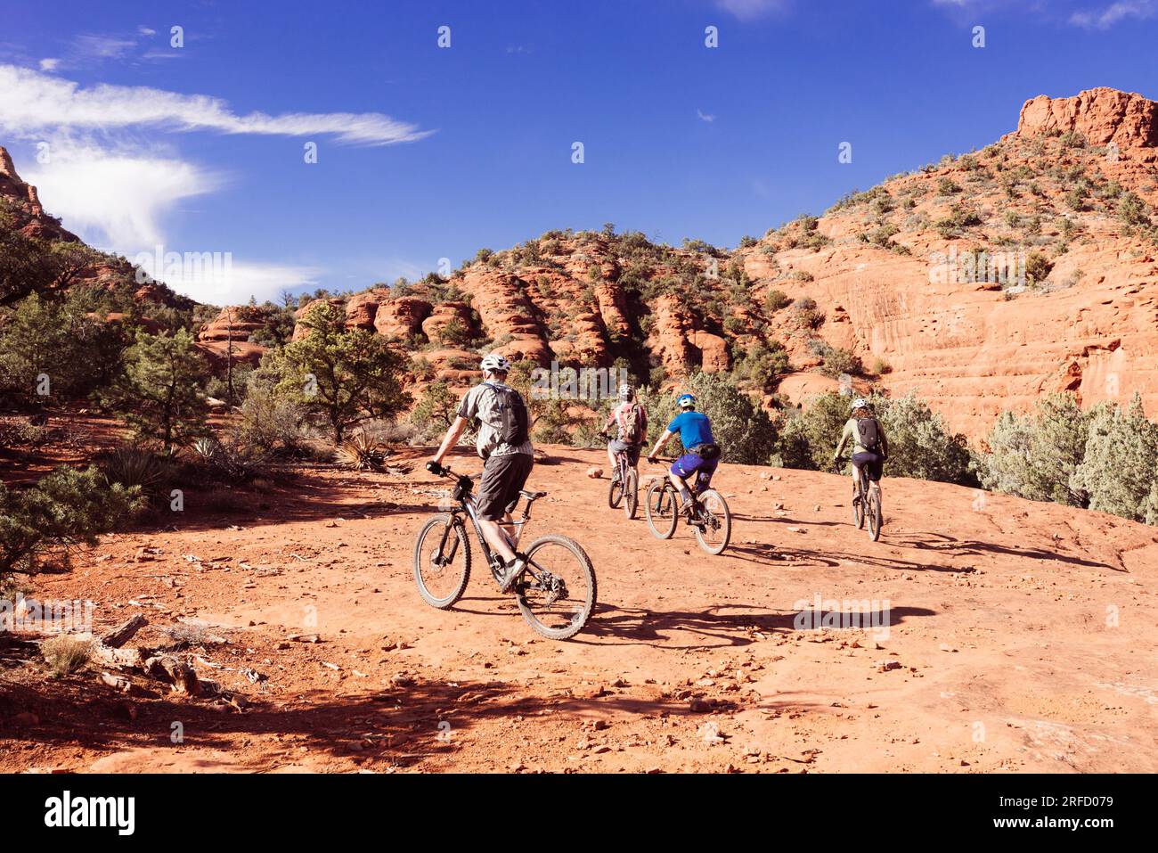 A group of mountain bikers enjoy the rocky trails in the Red Rock state ...