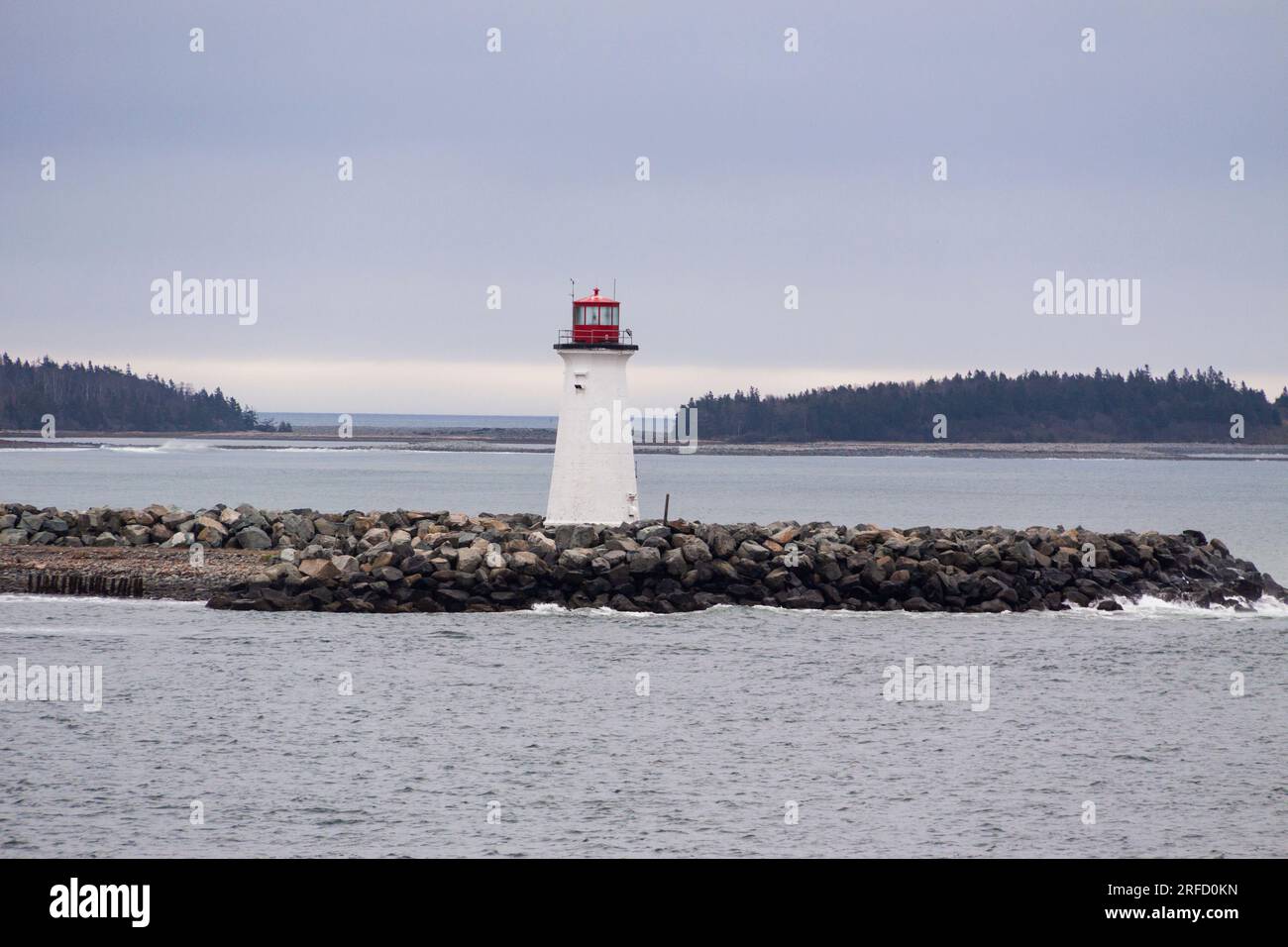 Maughers Beach Lighthouse, established 1815, stands at the end of a ...